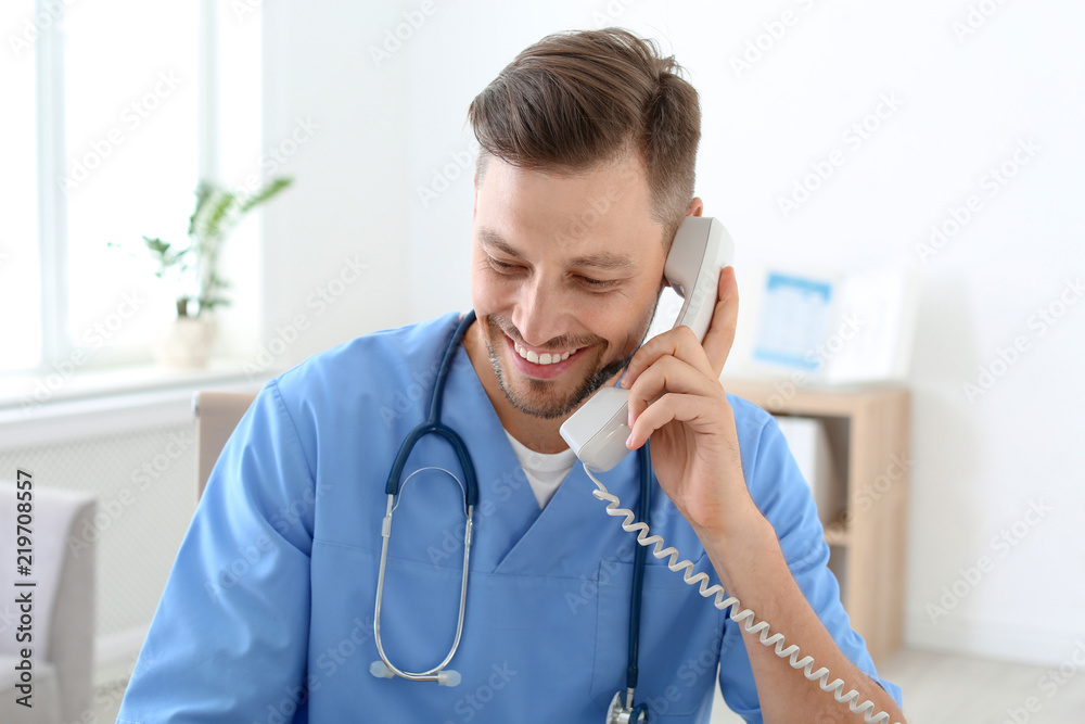 Male medical assistant in clinic. Health care service Stock Photo ...