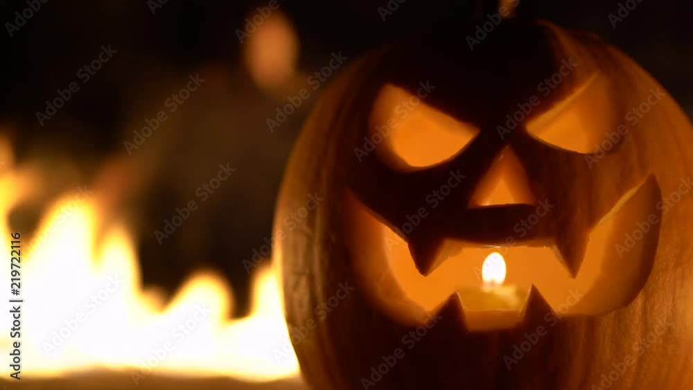 Orange mad pumpkin as head of Jack-o-lantern with carved eyes and ...