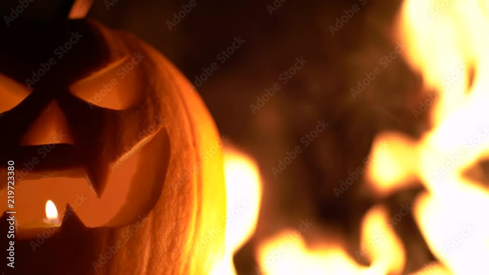 Orange mad pumpkin as head of Jack-o-lantern with carved eyes and ...