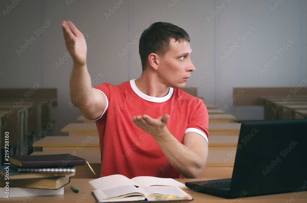 The student is sitting at the table and is looking for excuses for not ...