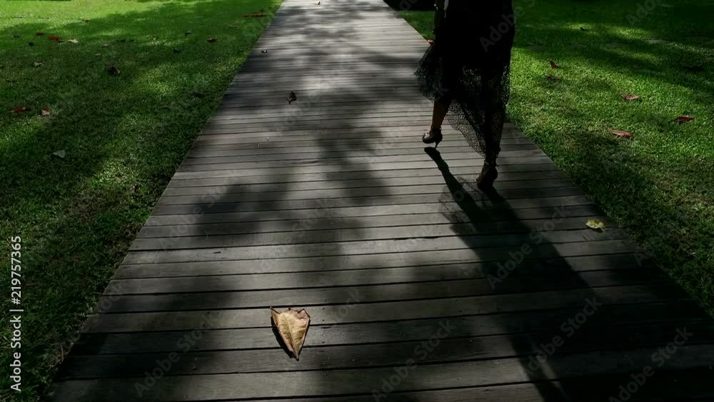 Camera tracking slow motion rear view the leg of women with swaying ...