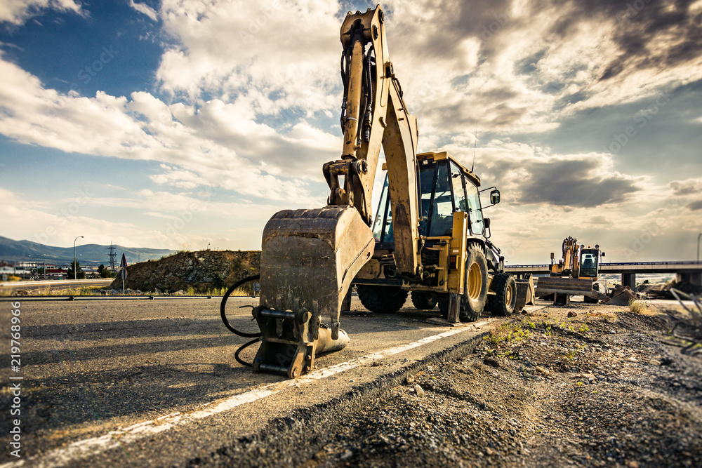 Repairing a road with professional equipment Stock Photo | Adobe Stock