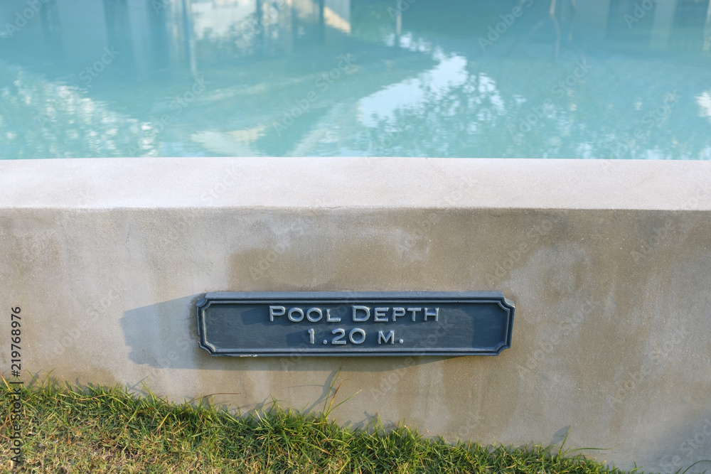 warning pool depth sign by swimming pool in modern resort for safety in ...
