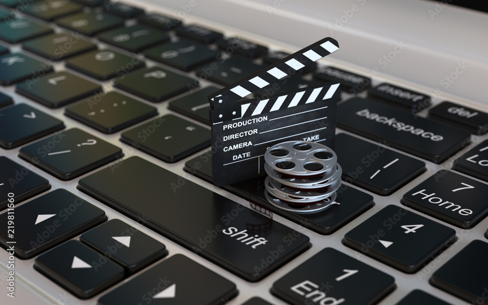 Laptop with films reel and movie clapper, Video editing or online movie ...