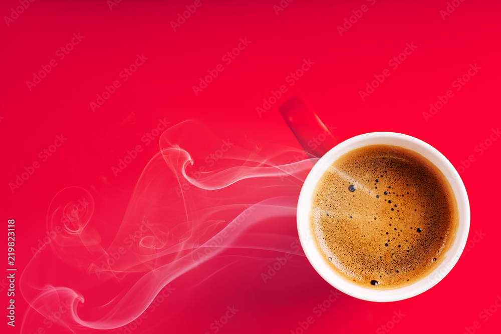 Fragrant coffee on a red background for your advertising. Smoke from ...