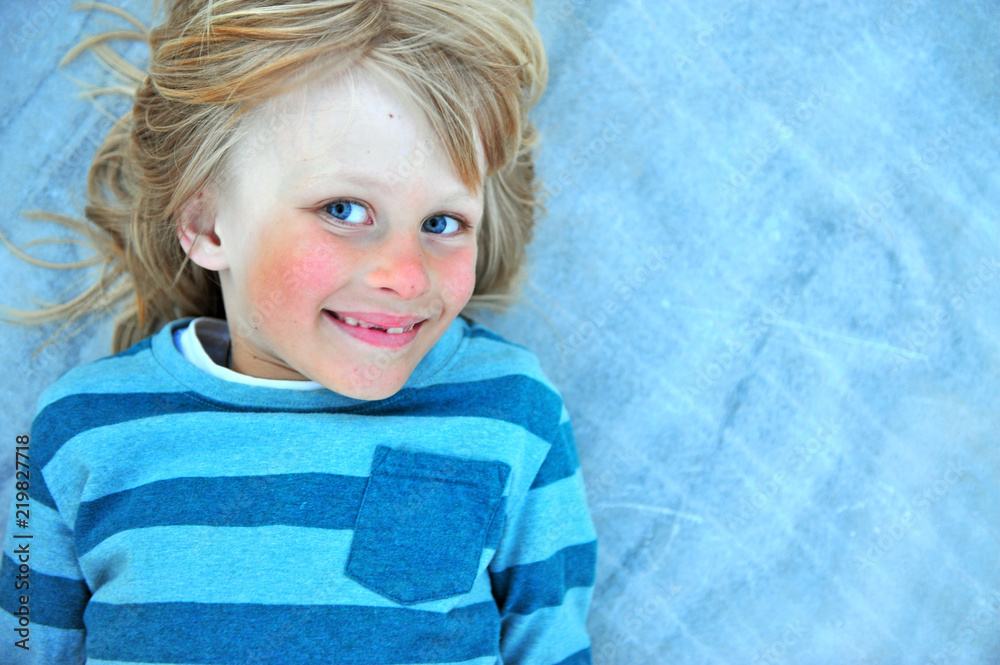 Portrat of sun-tanned kid, top view Stock Photo | Adobe Stock