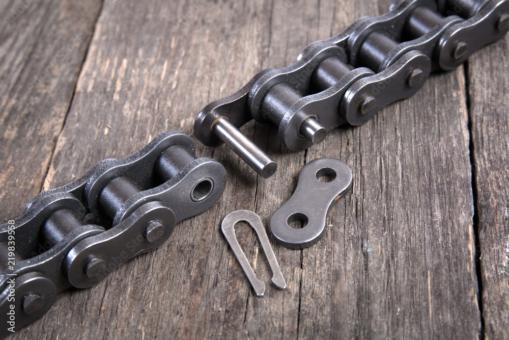 Industrial driving roller chain. Part of the chain drive of machine ...