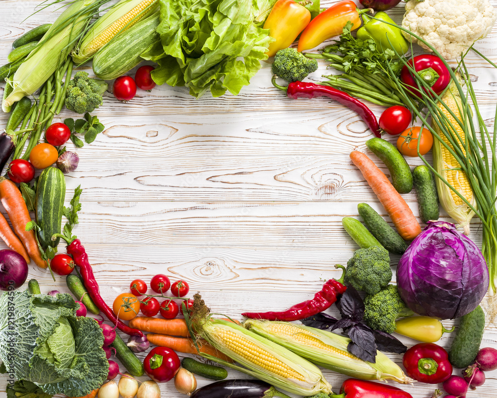 Vegetables spread out in a circle on the woody table, Healthy natural ...