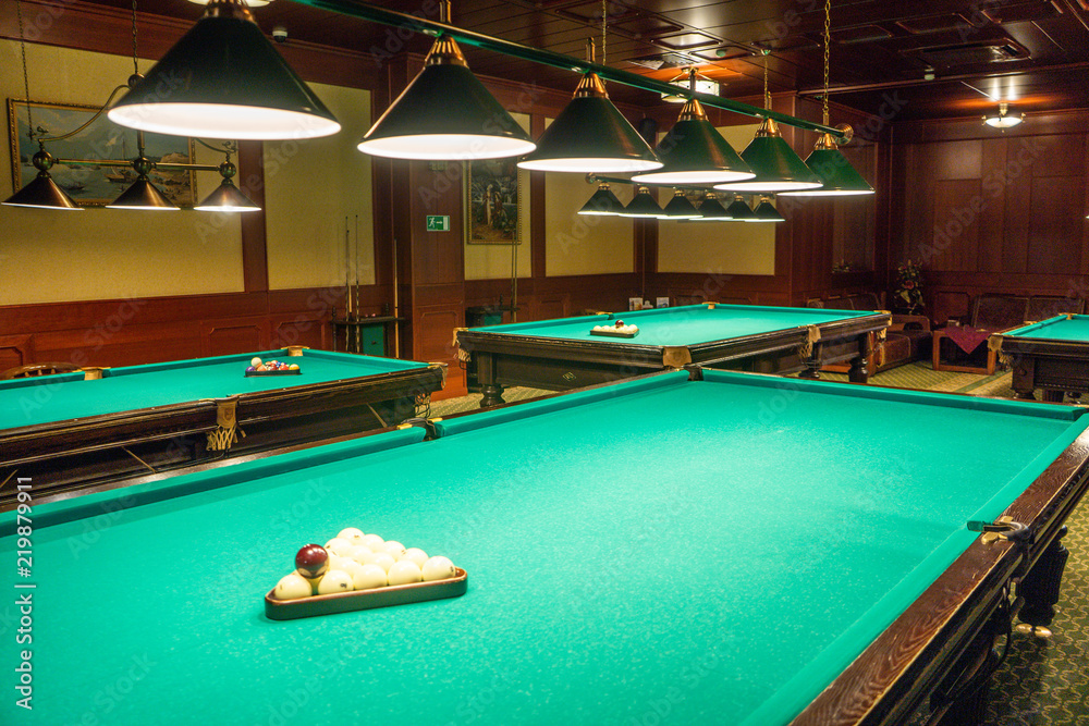 A Pool Table, set up for a game A game of 8 Ball, racked and ready to ...