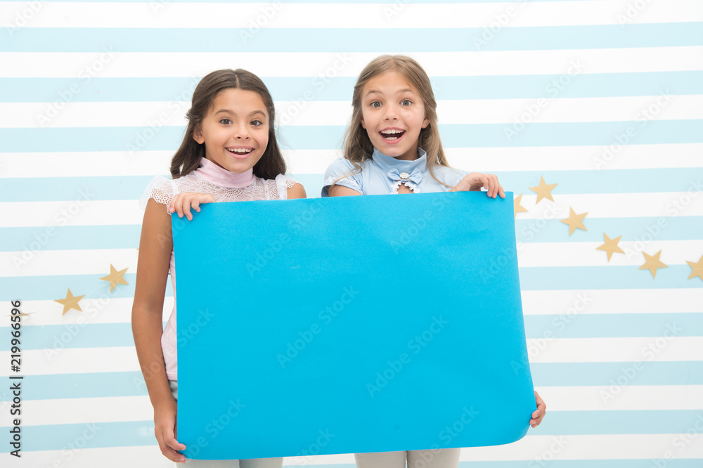 kids make advertisement. advertising your product. smiling little girls ...