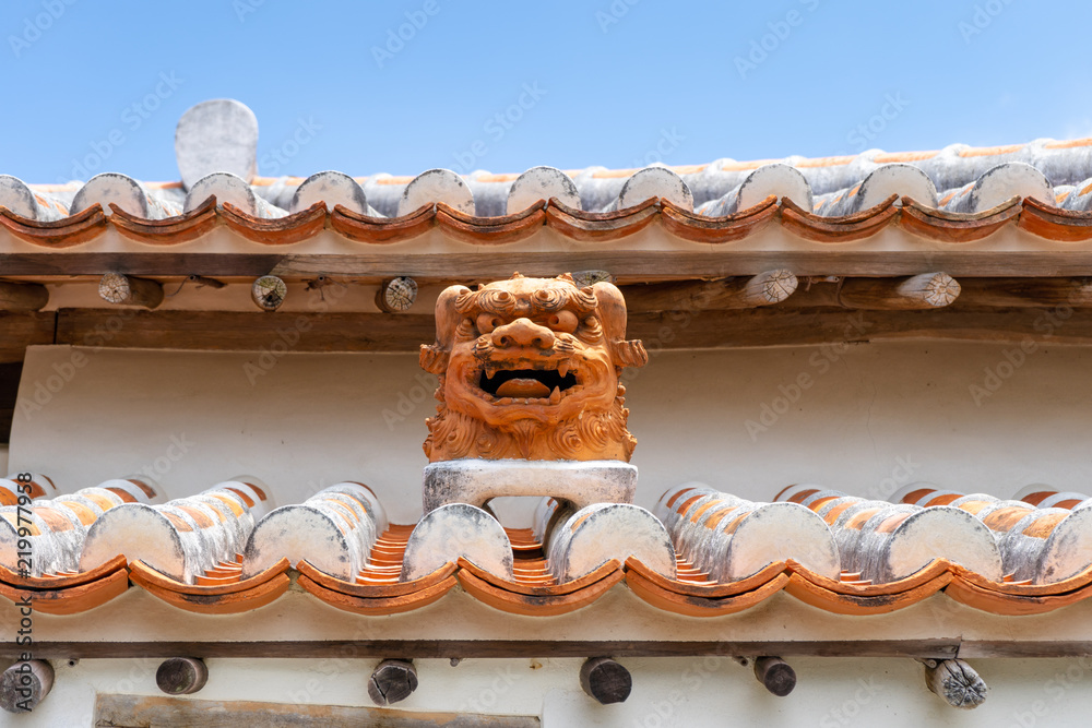Okinawa Ryukyu style roof with a sculpture of Shisa mythical lion dog ...