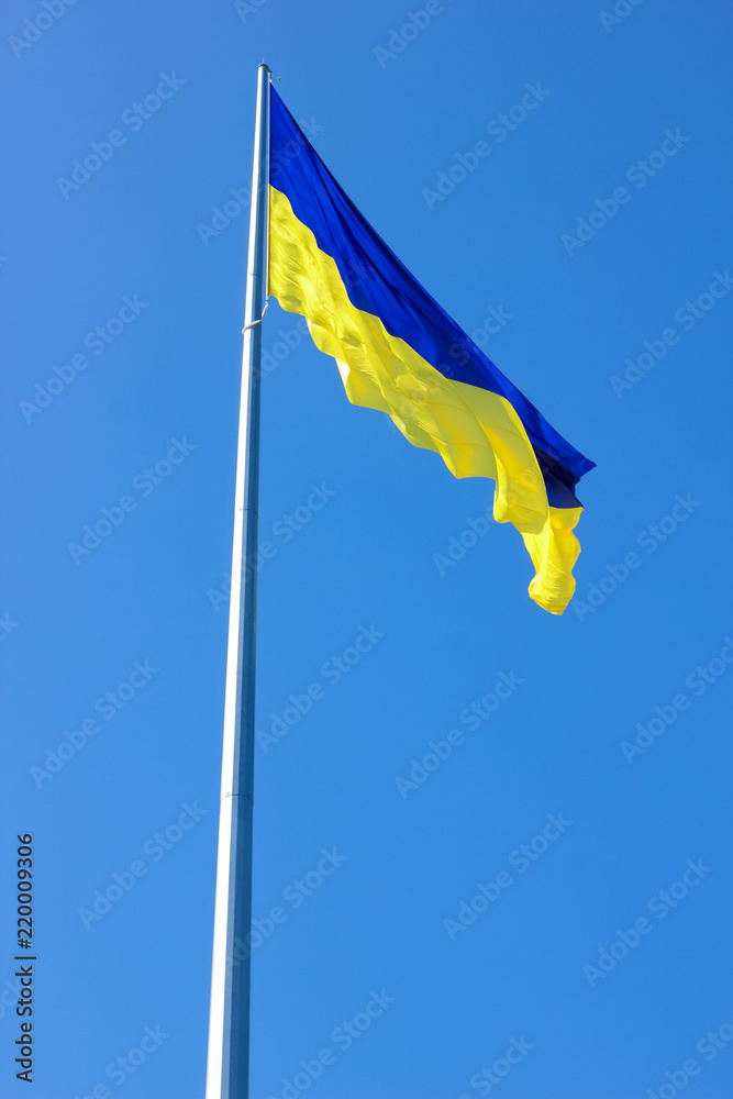 Ukrainian flag. Yellow blue Ukrainian flag on the background of the sky ...