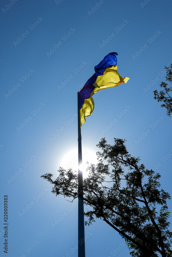 Ukrainian flag. Yellow blue Ukrainian flag on the background of the sky ...