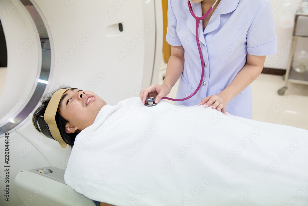Process of CT scanning of an old patient. Man Receiving a Medical Scan ...