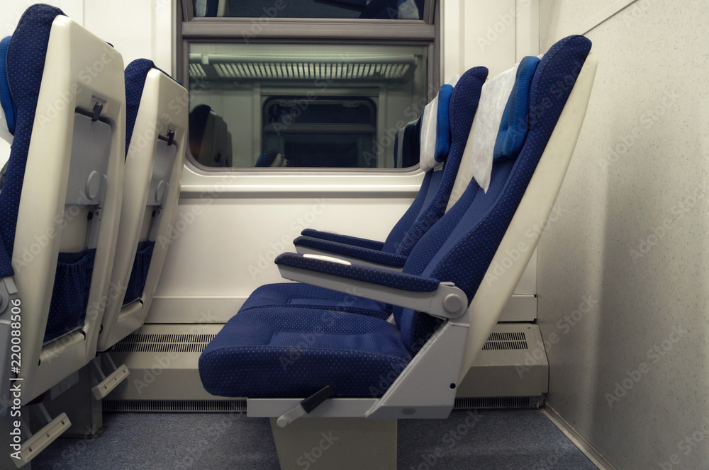 Empty chairs in the train side view. The interior of the railway wagon ...