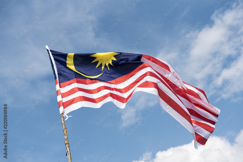 Malaysia flag also known as Jalur Gemilang wave with the blue sky ...