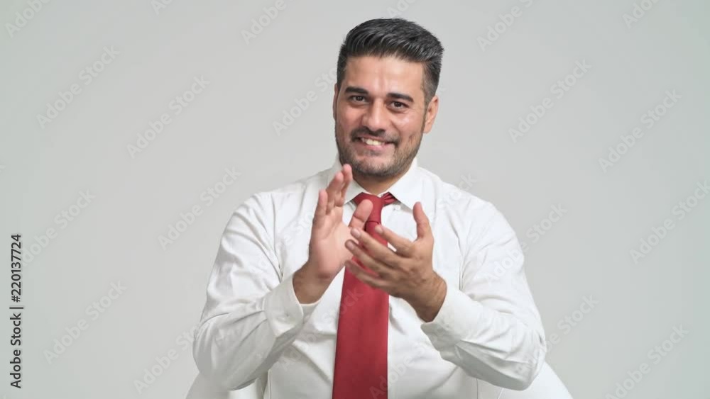 Happy businessman clapping portrait in white background. Young indian ...