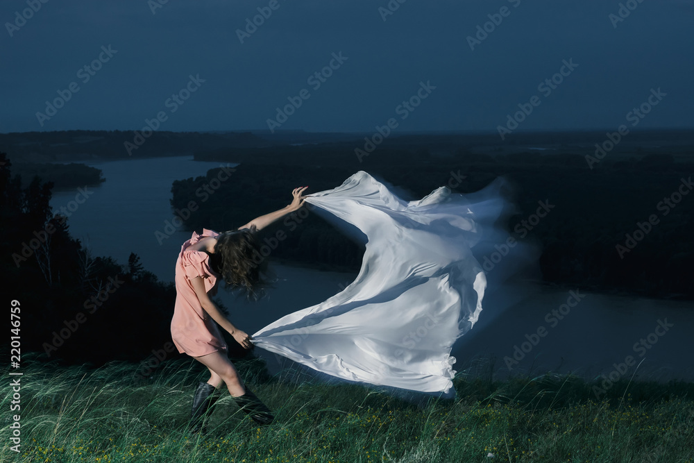 Amazing girl dancing in pink dress with big white shawl at night on ...
