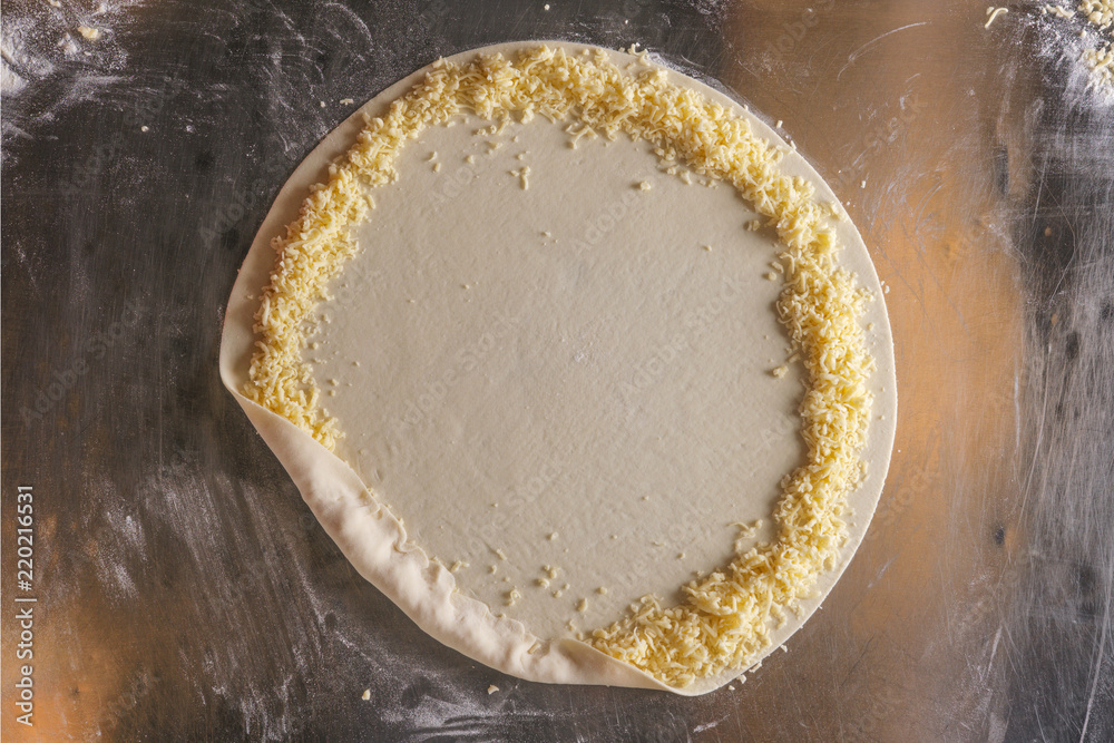 Making cheese border of pizza. Top view of filling. Stock Photo | Adobe ...