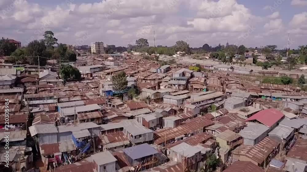 Remarkable aerial shot above vast overpopulated slums in Kibera ...