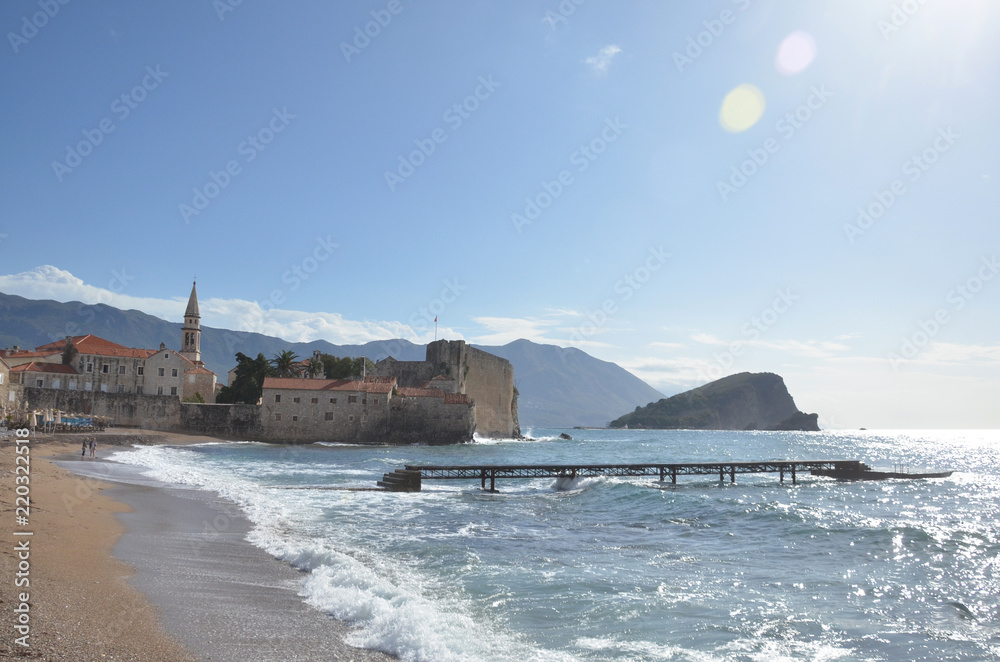 Mogren Beach is hidden behind the old town at Budva, this small beach ...