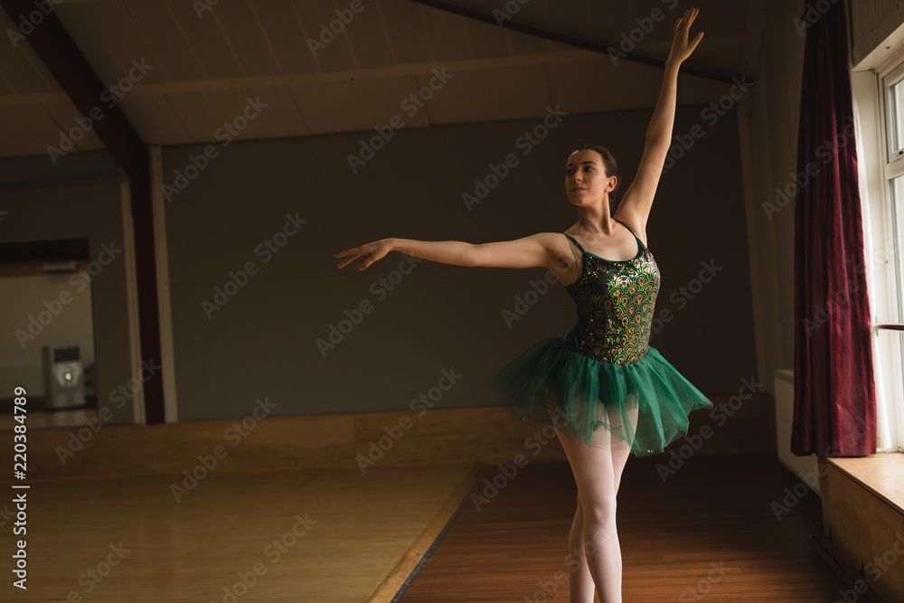 Ballerina practice arabesque ballet position in dance studio Stock ...