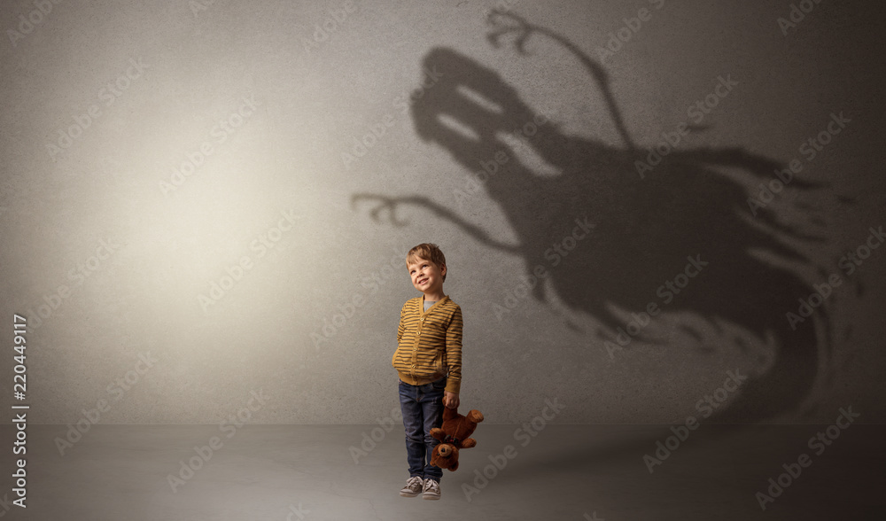 Scary ghost shadow in a dark empty room with a cute blond child Stock ...