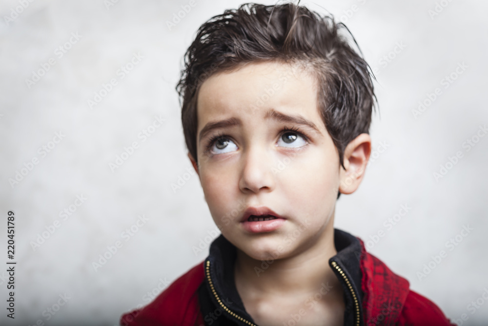 Little Boy with Worried Look Stock Photo | Adobe Stock