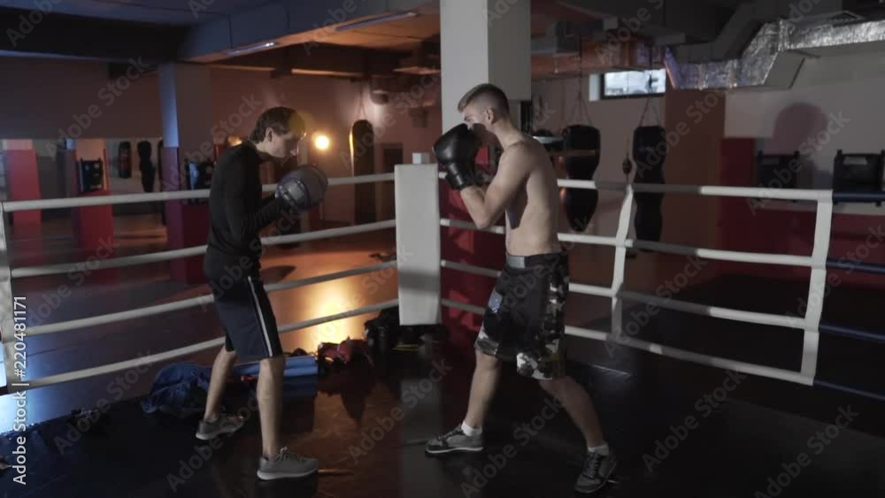 Slow-motion shooting fight club. Boxers train before the fight in the ...