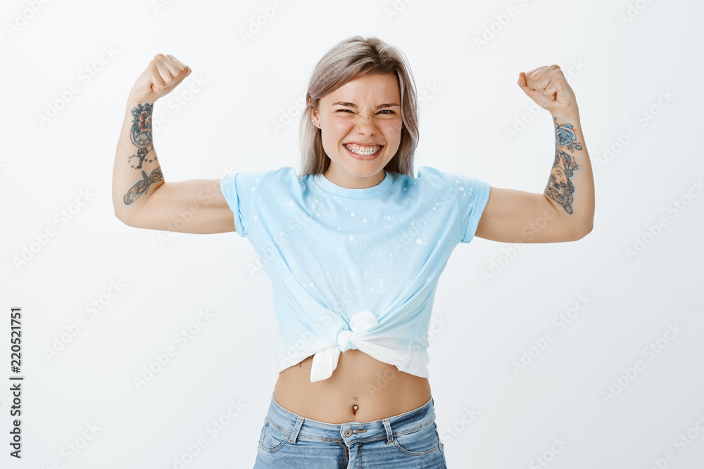 Show me real power of muscles. Portrait of good-looking playful and ...