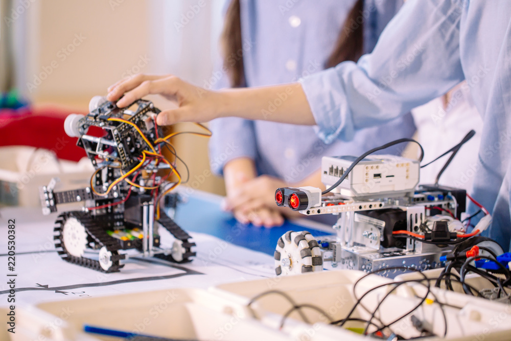 Close up of construction workflow of electronic car with ...
