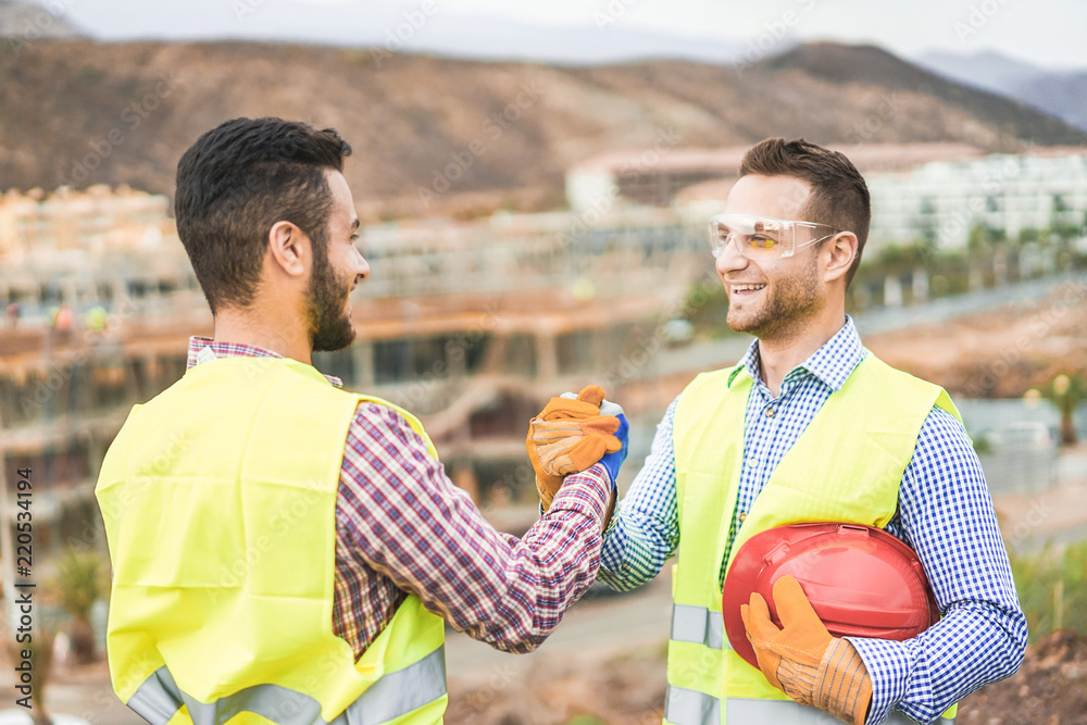 Builders on residential construction site making a deal Stock Photo ...