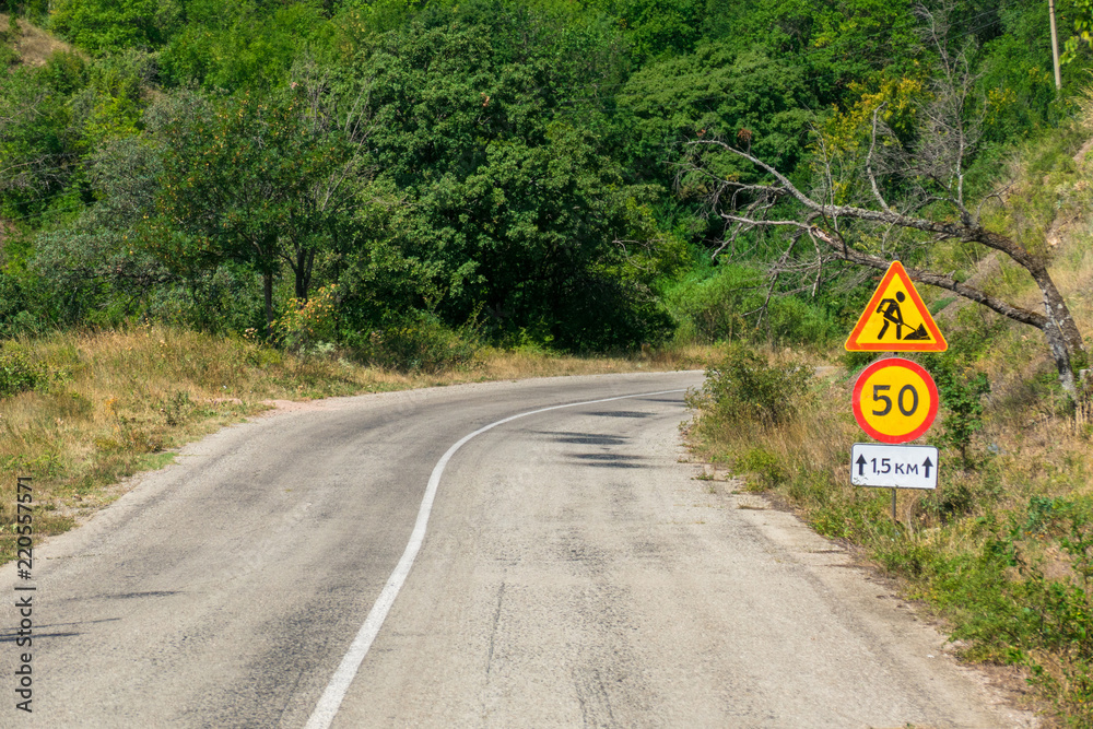 Roadside with traffic signs / Temporary road signs on wayside of ...