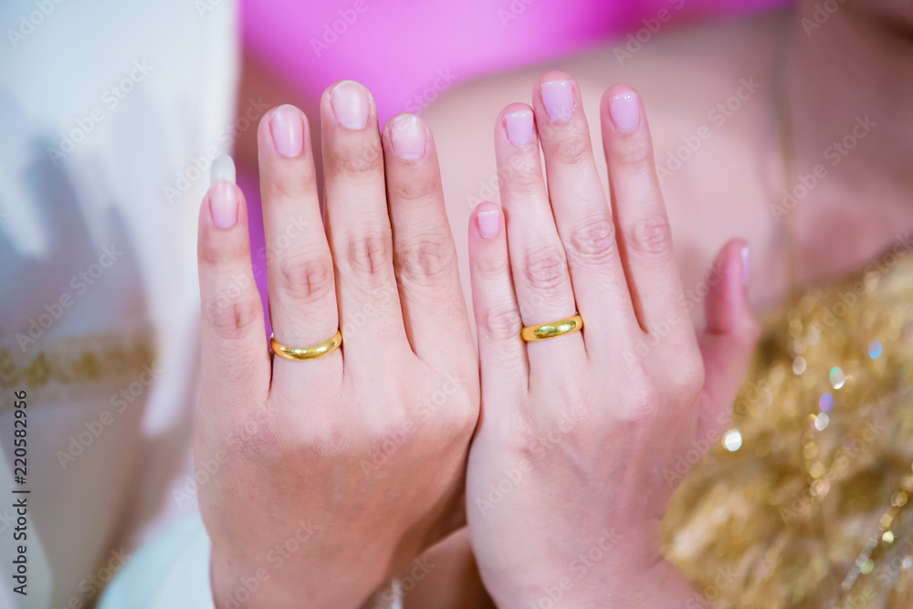 Young married couple holding hands, show wedding ring in ceremony ...