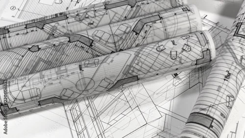 Blueprints - rolls of architectural drawings smoothly rotate on the ...