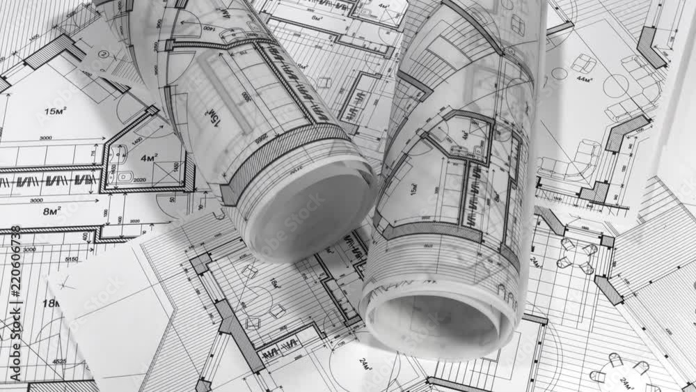 Blueprints - rolls of architectural drawings smoothly rotate on the ...