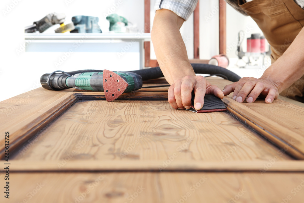 carpenterr hands work the wood with sandpaper and sander Stock Photo ...
