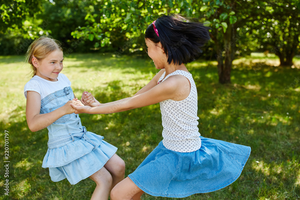Two girls play together Stock Photo | Adobe Stock