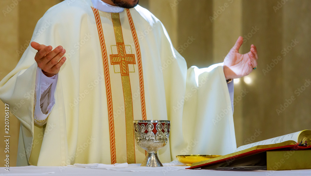 Holy communion on wooden table in church cup of glass with red wine ...