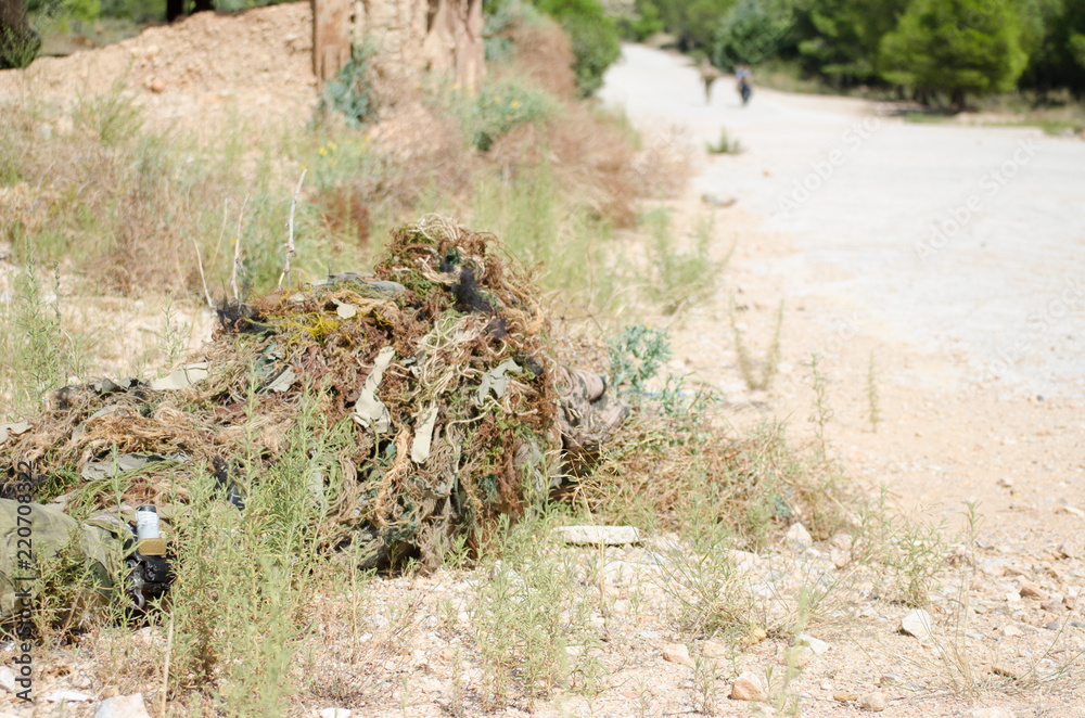Sniper prone supported position aim man bush camouflage outside Stock ...