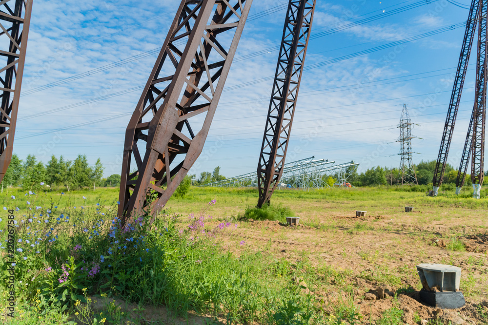 New poles for power lines lying on the ground. For the next ...
