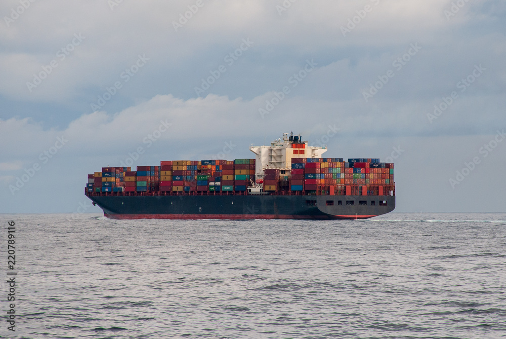 Container ship underway in the North Atlantic, well loaded. Calm seas ...