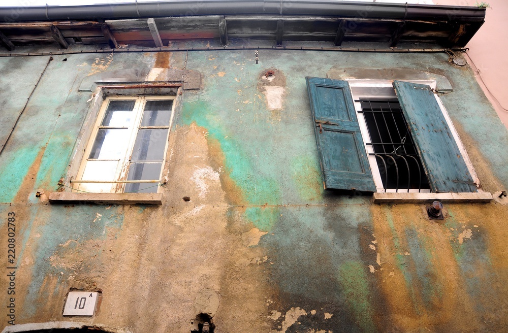 Old and damaged uninhabited building facade. Stock Photo | Adobe Stock