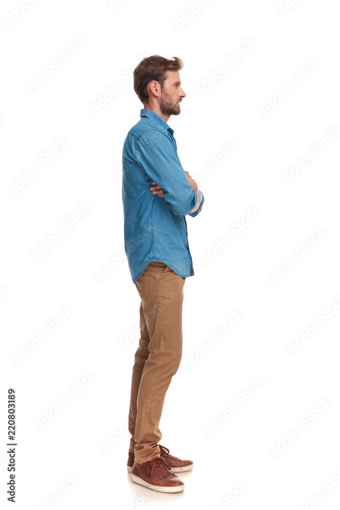 young casual man standing in line with hands crossed Stock Photo ...