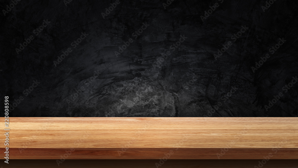 Empty wooden tabletop isolated on dark background. For your product ...
