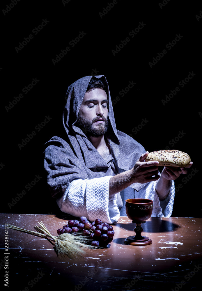 Jesus blessing the bread. Stock Photo | Adobe Stock
