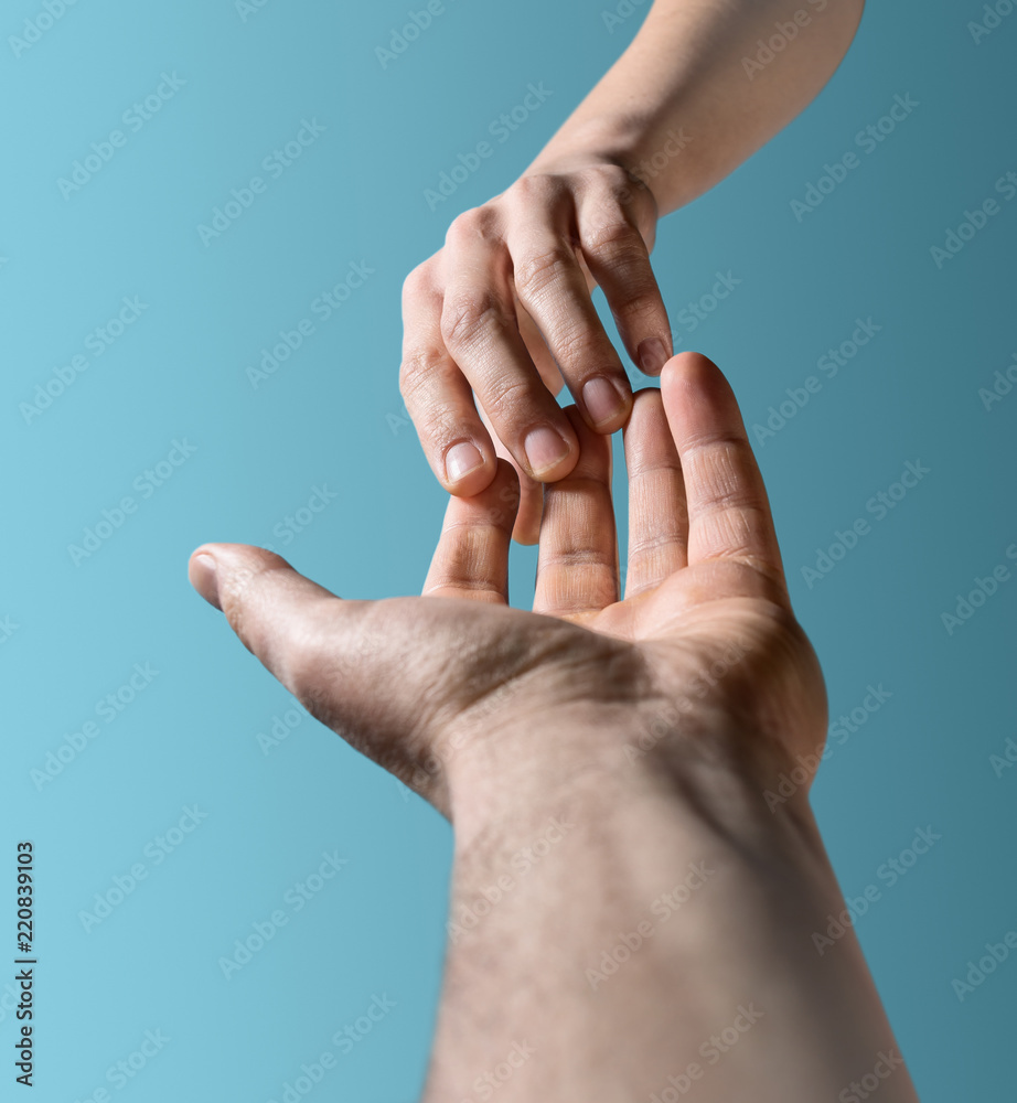 Emotional photo of two hands at the moment of farewell. The concept of ...