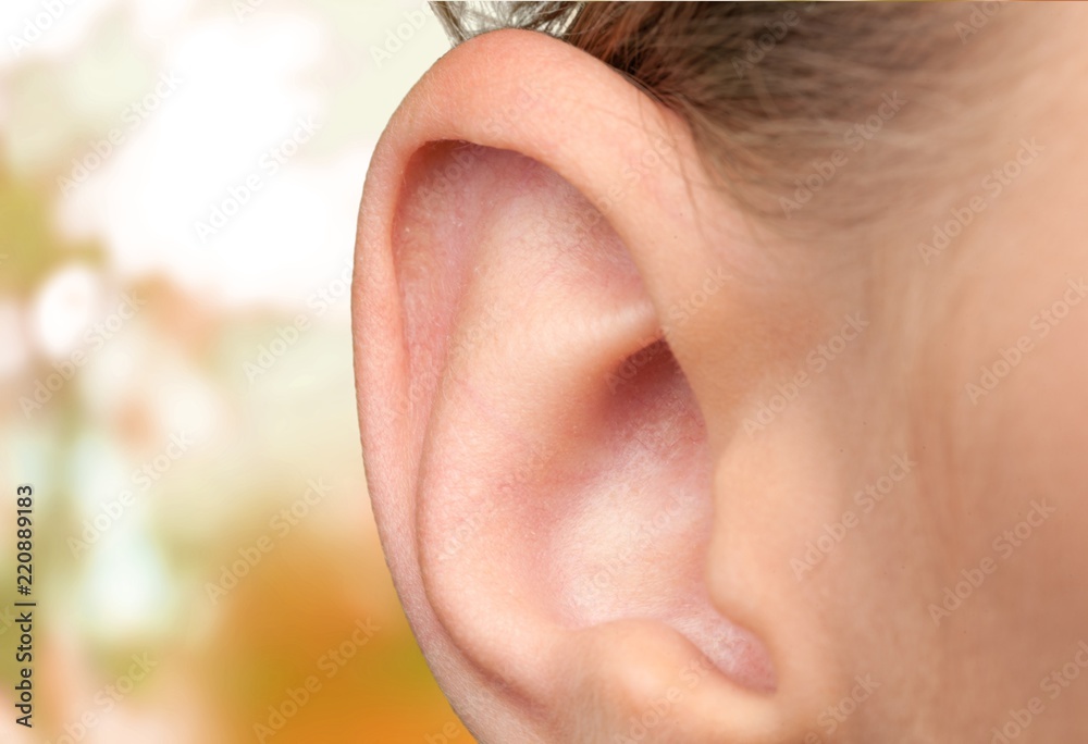Girl listening with her hand on an ear cose up Stock Photo | Adobe Stock