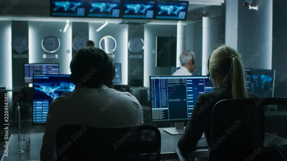 Back View of the Cyber Security Dispatchers Working on Personal ...