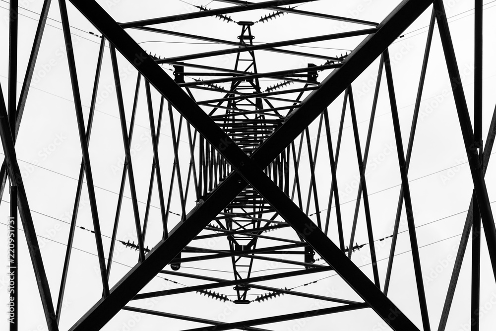 Under overhead high-voltage power line tower. View from bottom of ...